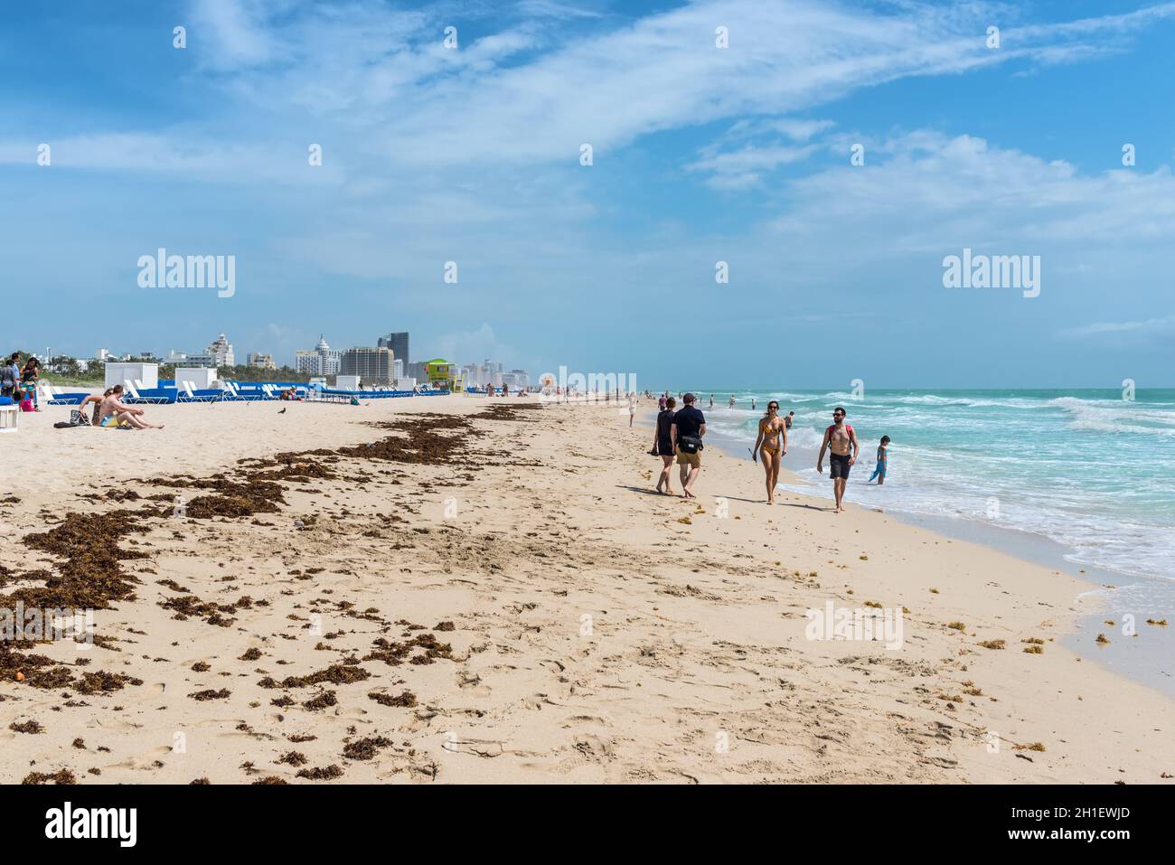 Miami, FL, USA - April 19, 2019: People on beach enjoying sun in South ...
