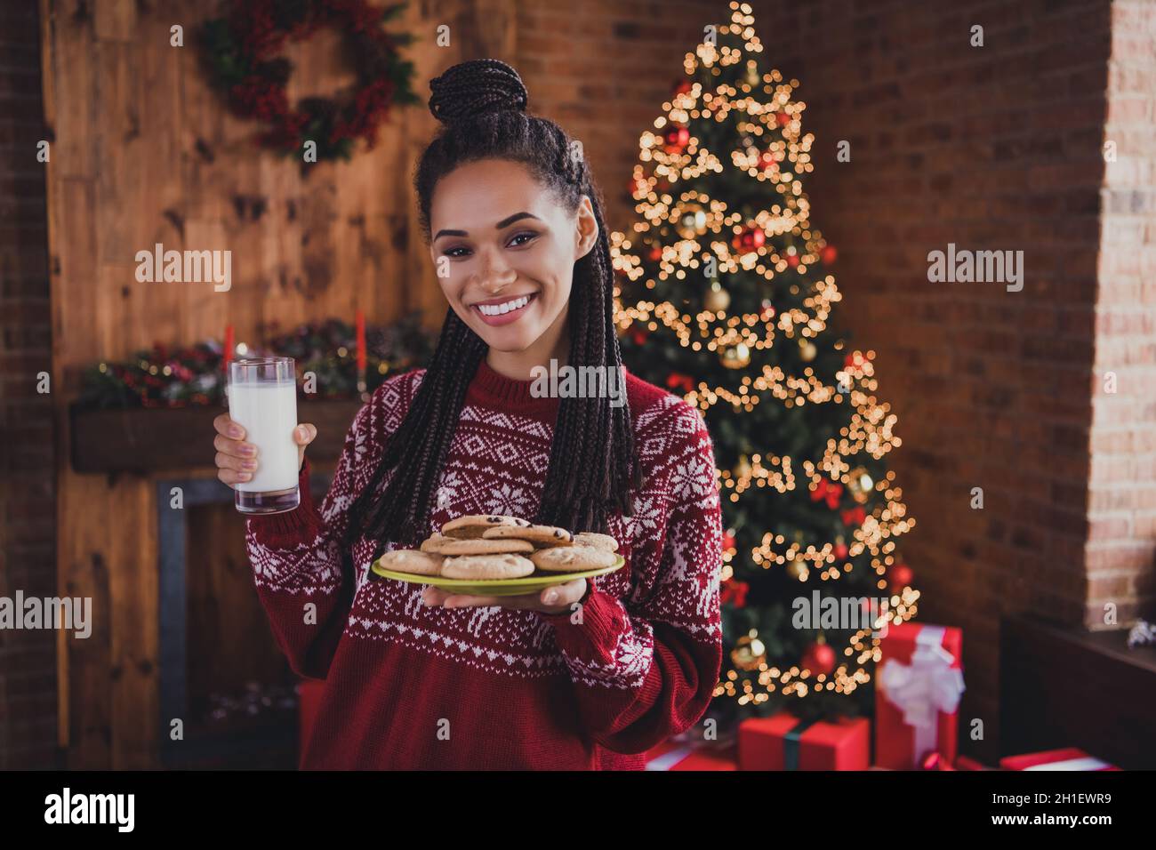 Photo of positive pretty cute hospitable lady hold dish cookies milk ...