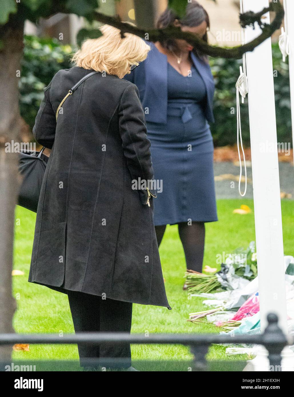 London, UK. 18th Oct, 2021. Parliamentary members and staff lay flowers ...