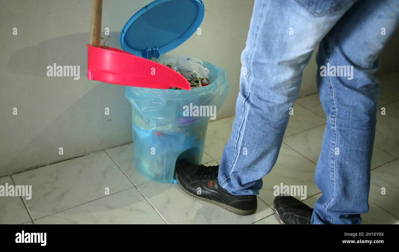 salvador, bahia / brazil - may 24, 2020: person is seen depositing ...