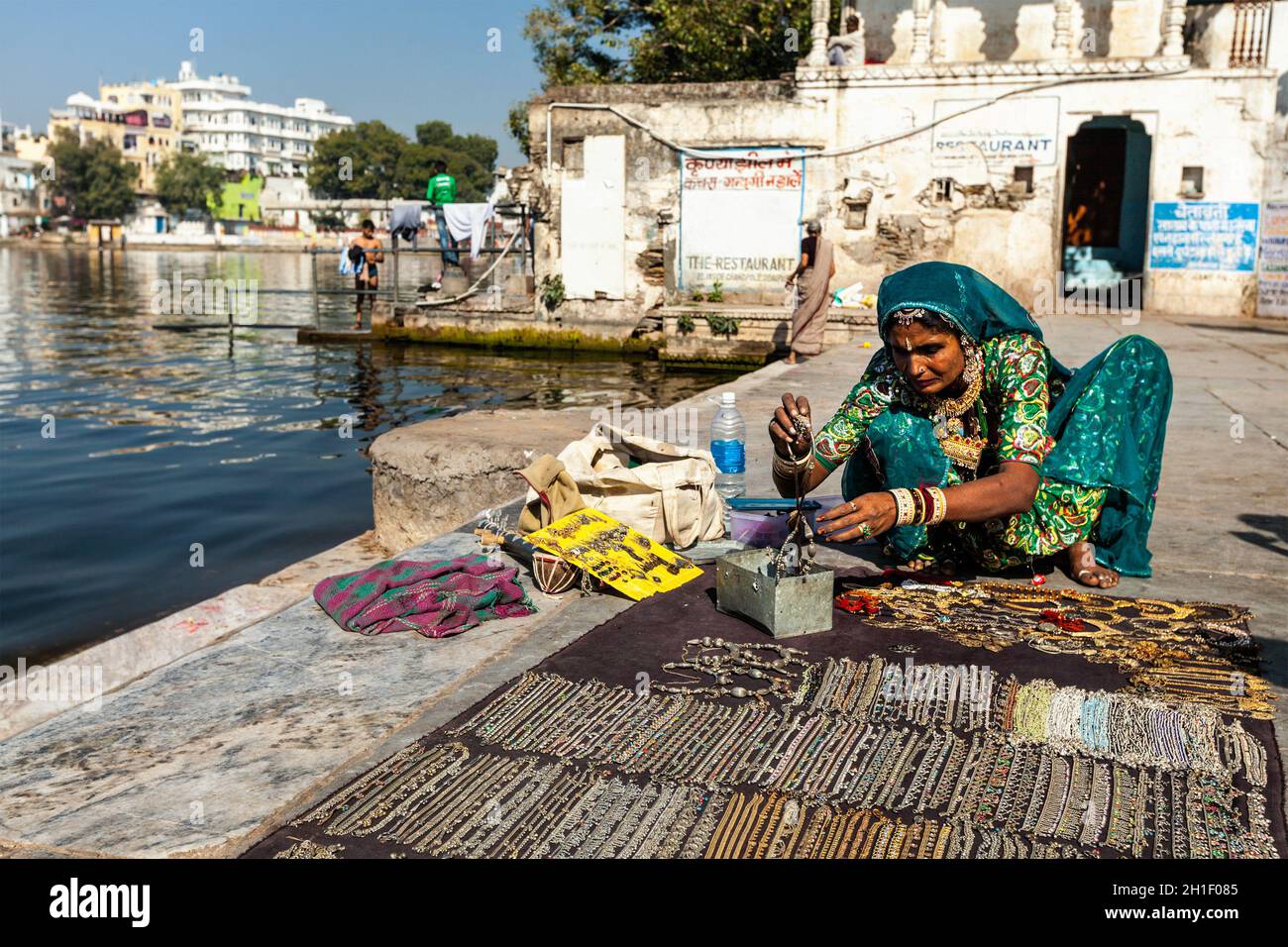 UDAIPUR, INDIA - NOVEMBER 24, 2012: Woman street vendor in traditional ...