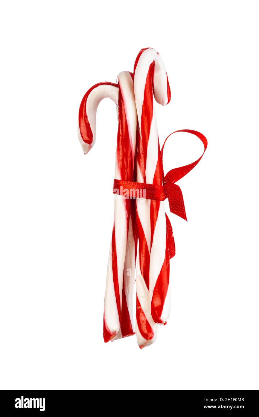 Stack of candy canes isolated on white background Stock Photo - Alamy