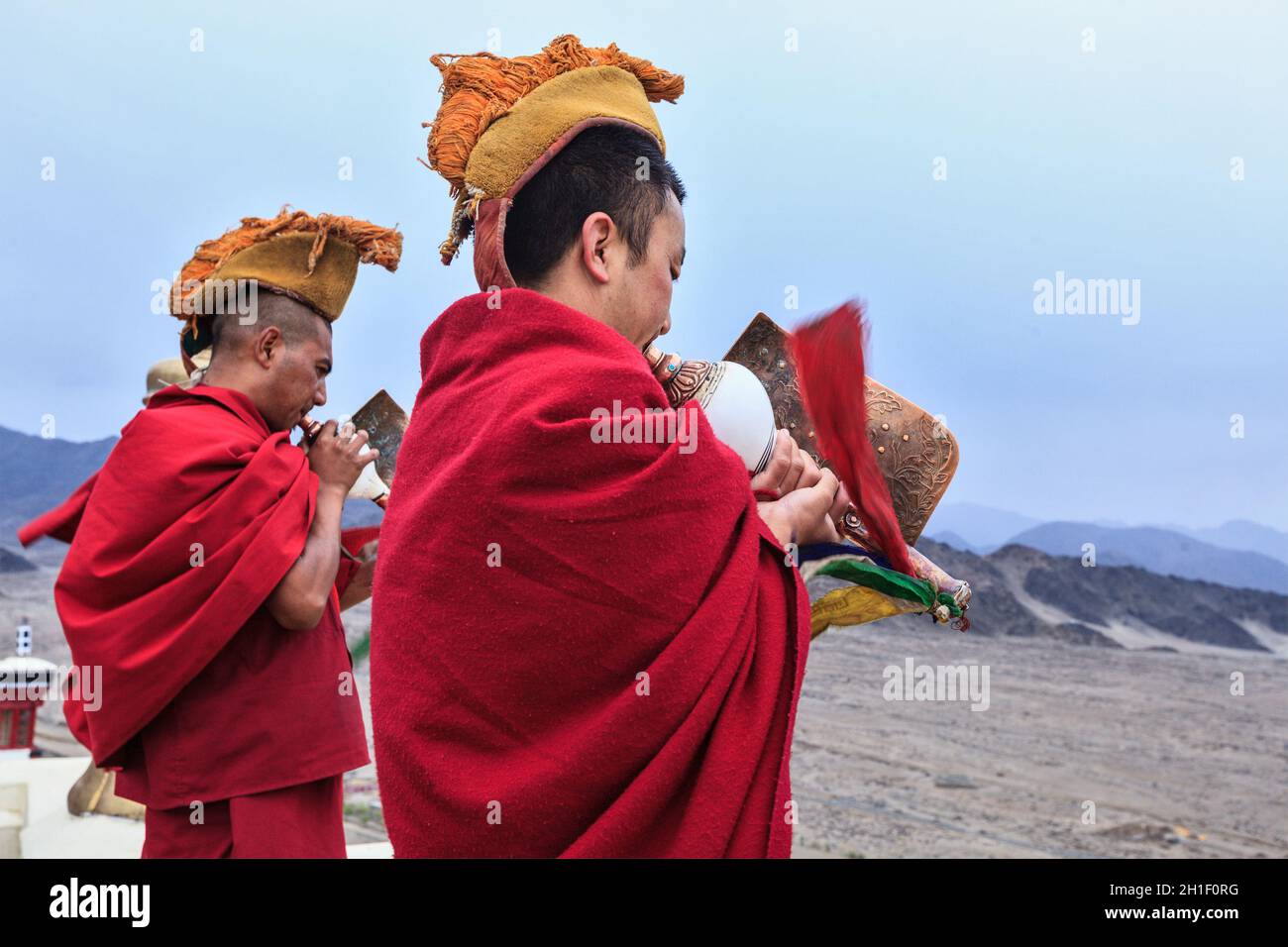 Blowing conches hi-res stock photography and images - Alamy