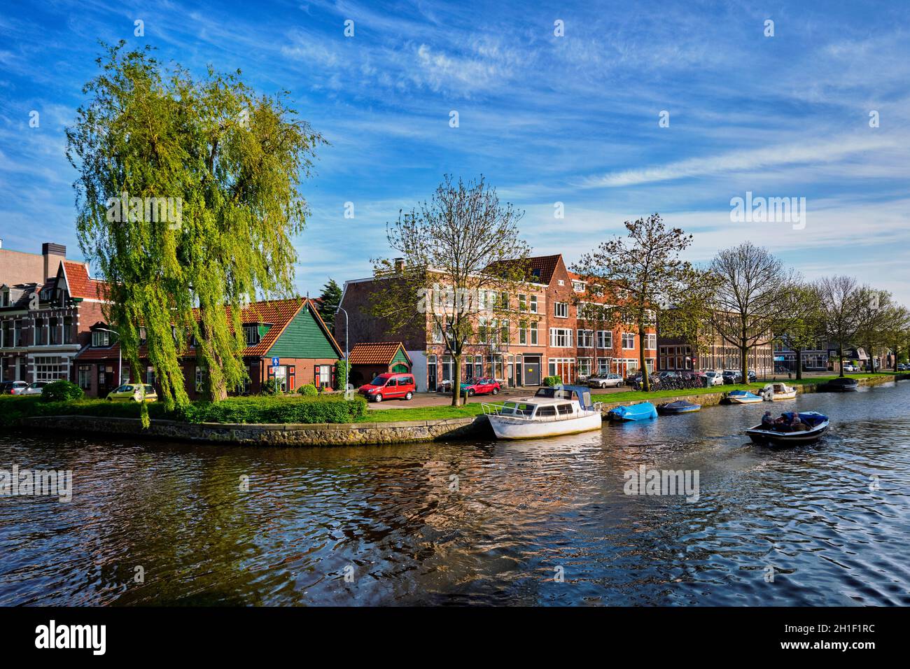 HAARLEM, NETHERLANDS - MAY 6, 2017: Boat in canal and houses. Harlem ...