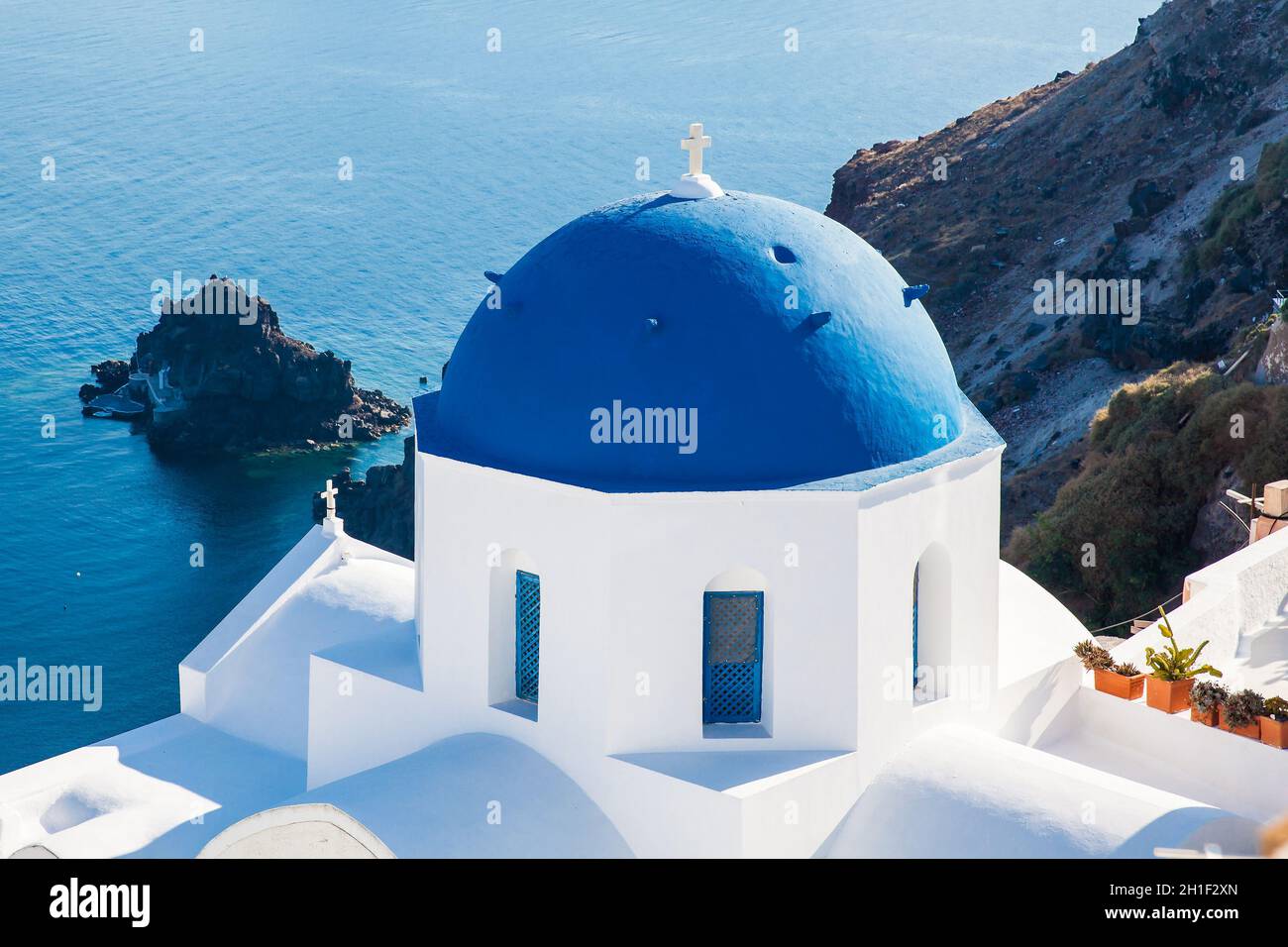 Traditional architecture of the churches of the Oia City in Santorini ...