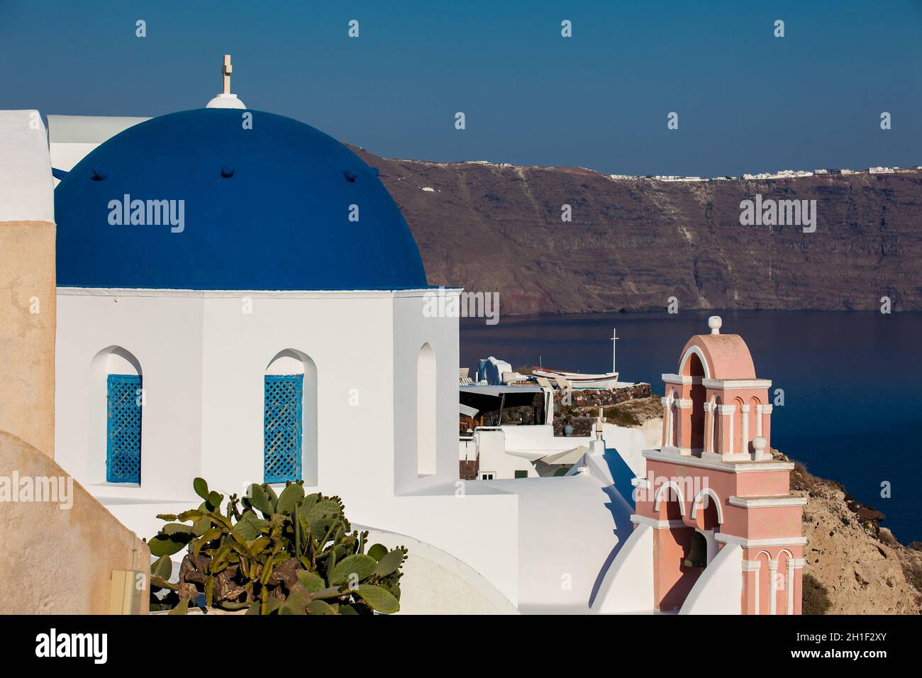 Traditional architecture of the churches of the Oia City in Santorini ...