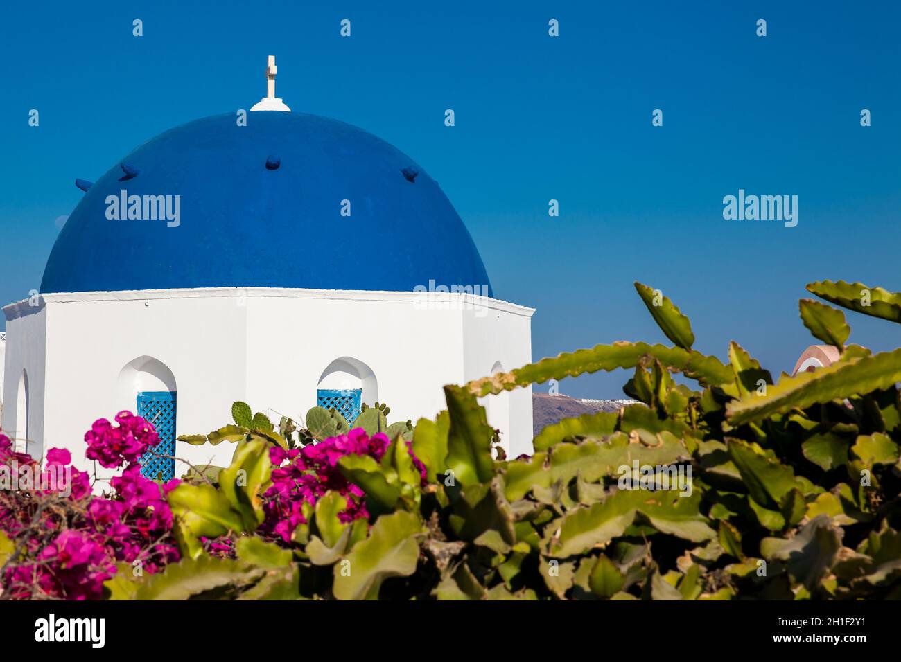 Traditional architecture of the churches of the Oia City in Santorini ...