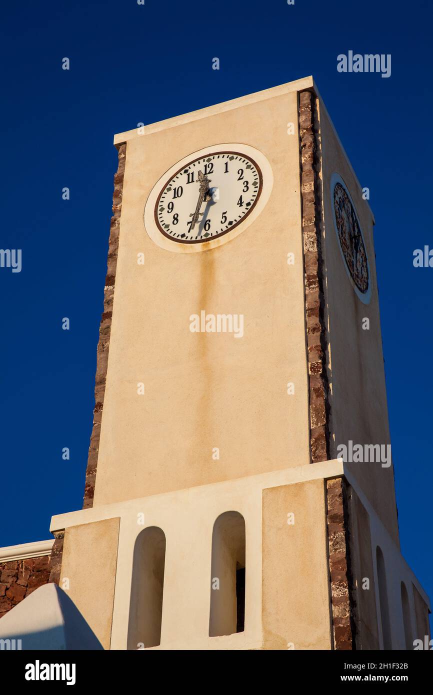 Clock tower at Oia city in the Santorini Island Stock Photo - Alamy