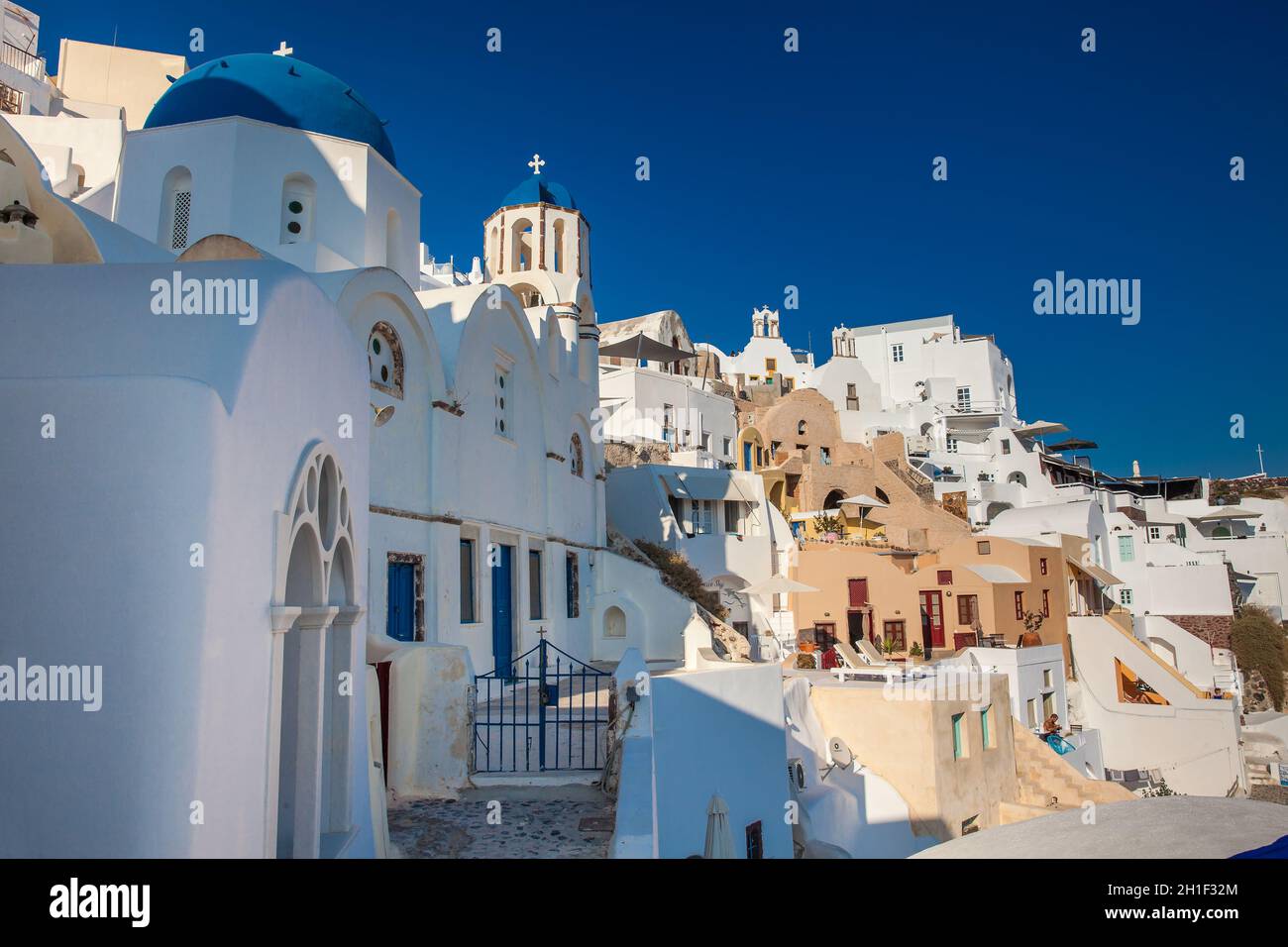 Traditional architecture of the churches of the Oia City in Santorini ...