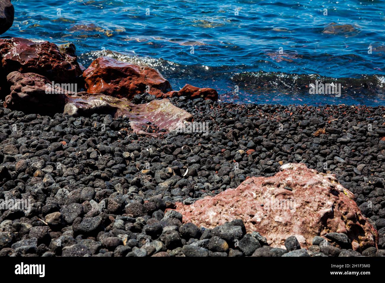 Detail of the rocks on the famous Red Beach at Santorini Island in a ...