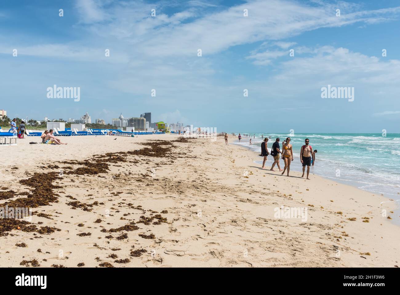 Miami, FL, USA - April 19, 2019: People on beach enjoying sun in South ...