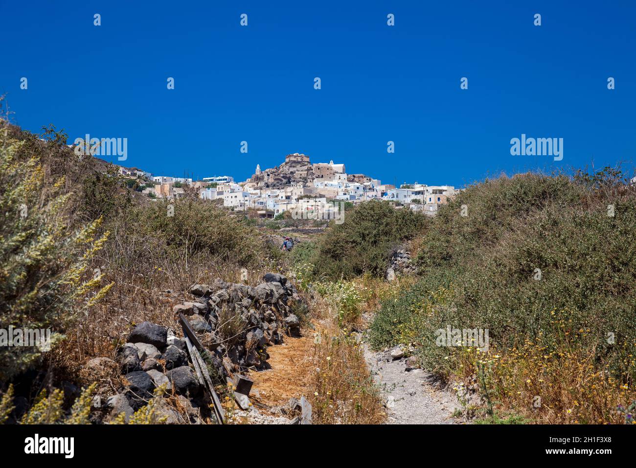 SANTORINI, GREECE - APRIL, 2018: Tourists at the walking path number 12 ...