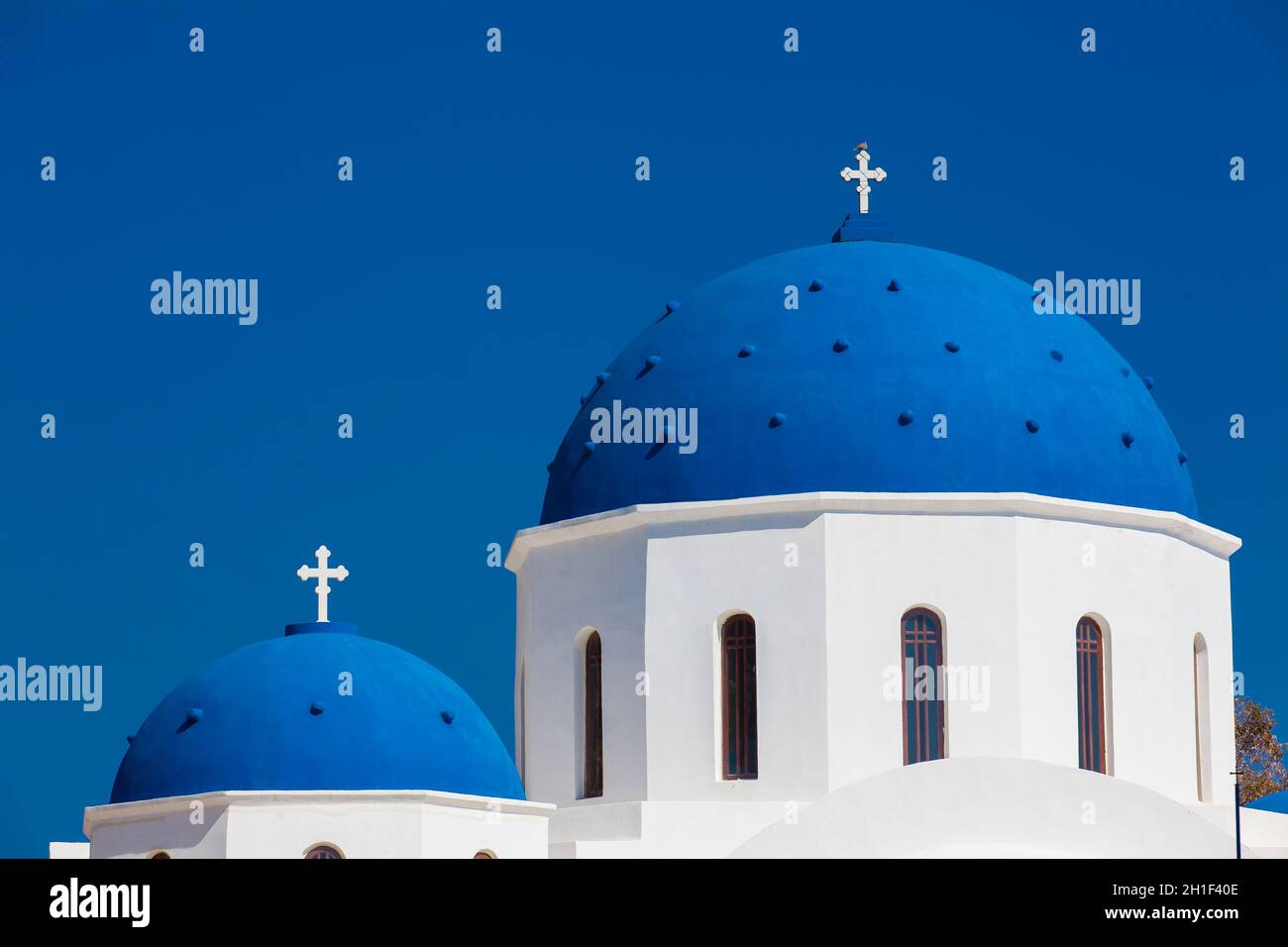 The Church of Holy Cross in the central square of Perissa on Santorini ...
