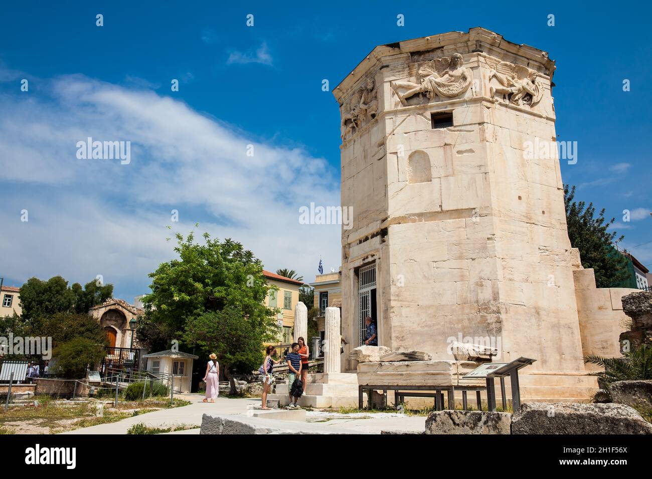 ATHENS, GREECE - APRIL, 2018: Tourists visiting the Tower of the Winds ...