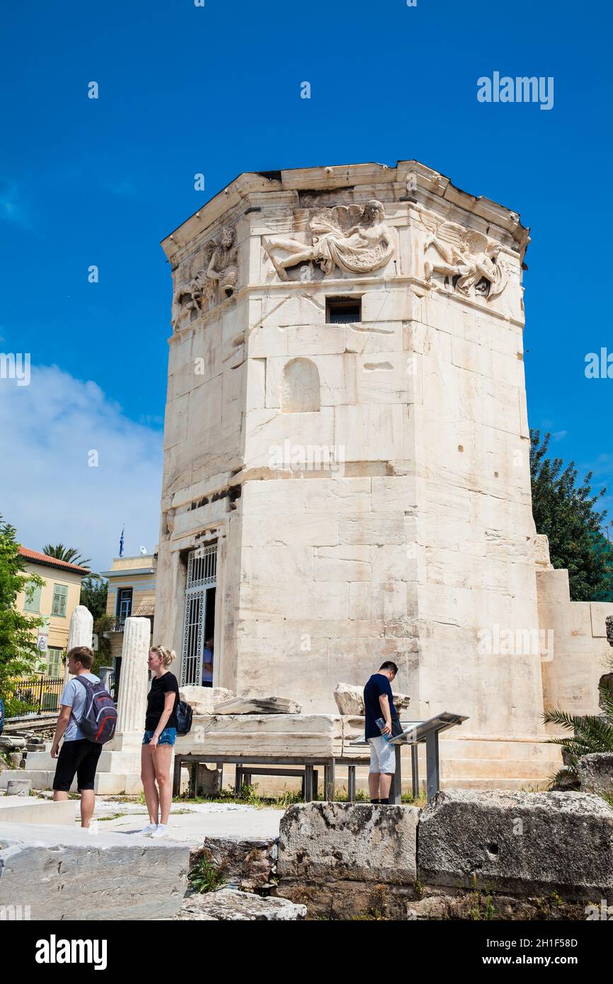 ATHENS, GREECE - APRIL, 2018: Tourists visiting the Tower of the Winds ...