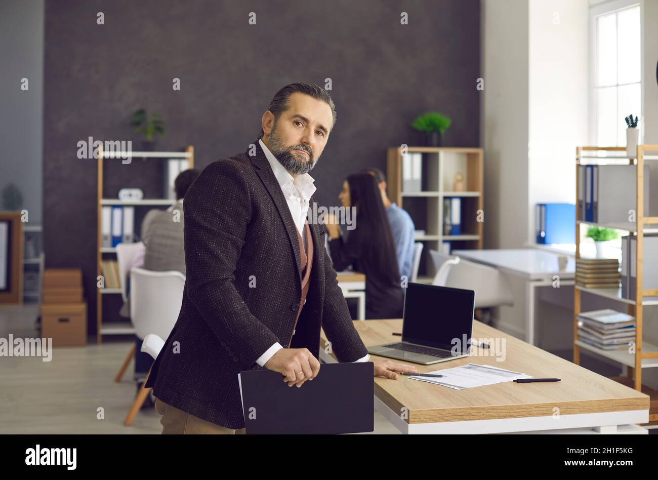 Senior executive looking laptop hi-res stock photography and images - Alamy