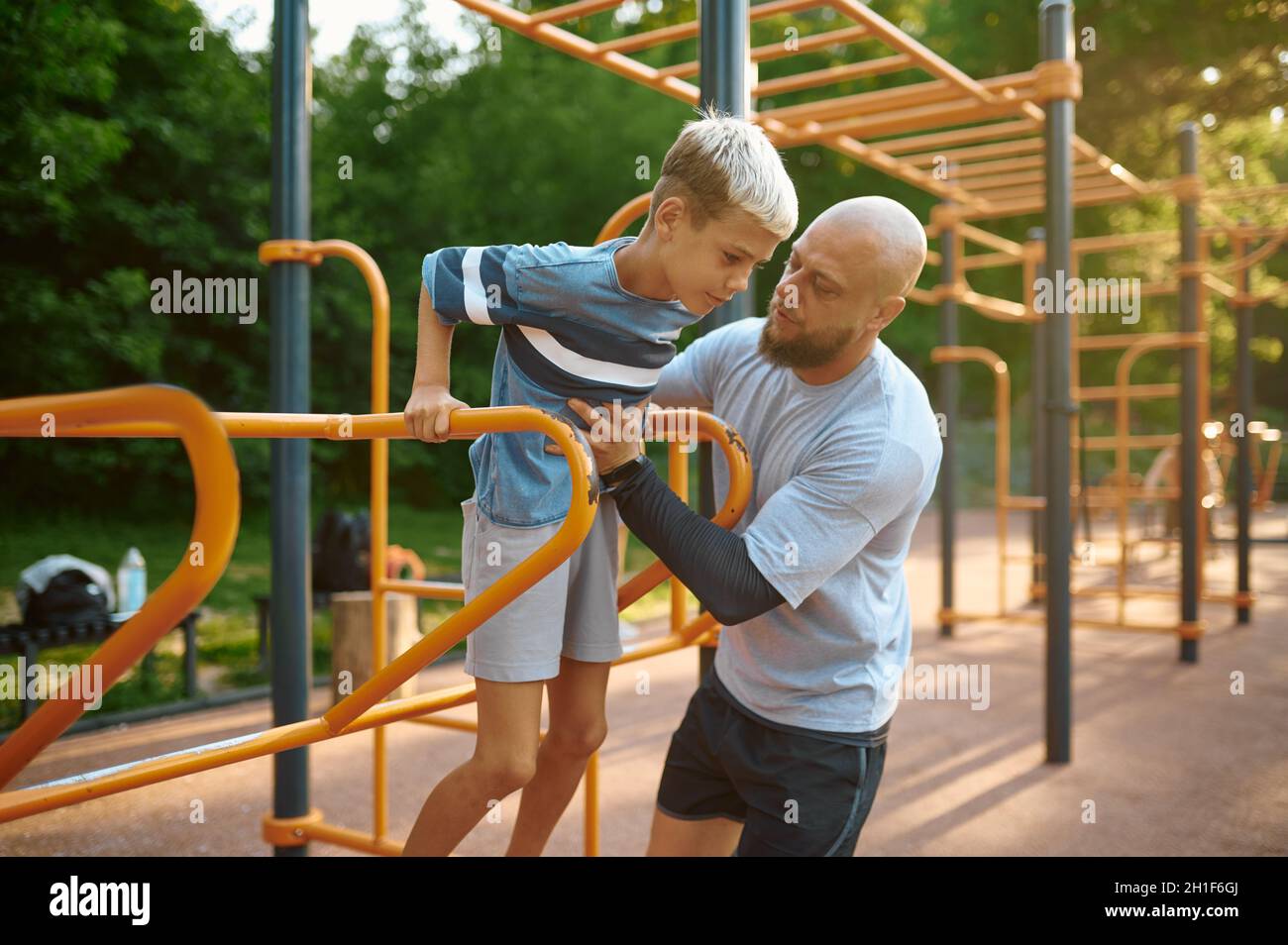 Father and son doing exercise, sport training Stock Photo - Alamy