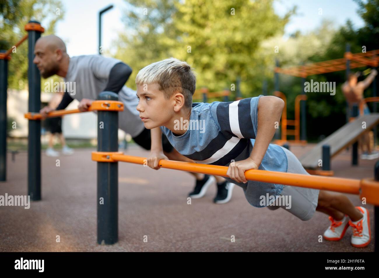 Father and child doing exercise, sport training Stock Photo - Alamy