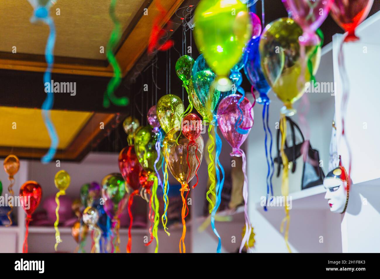 Moulticoloured group of glass balloons in a shop of artistic glass of ...
