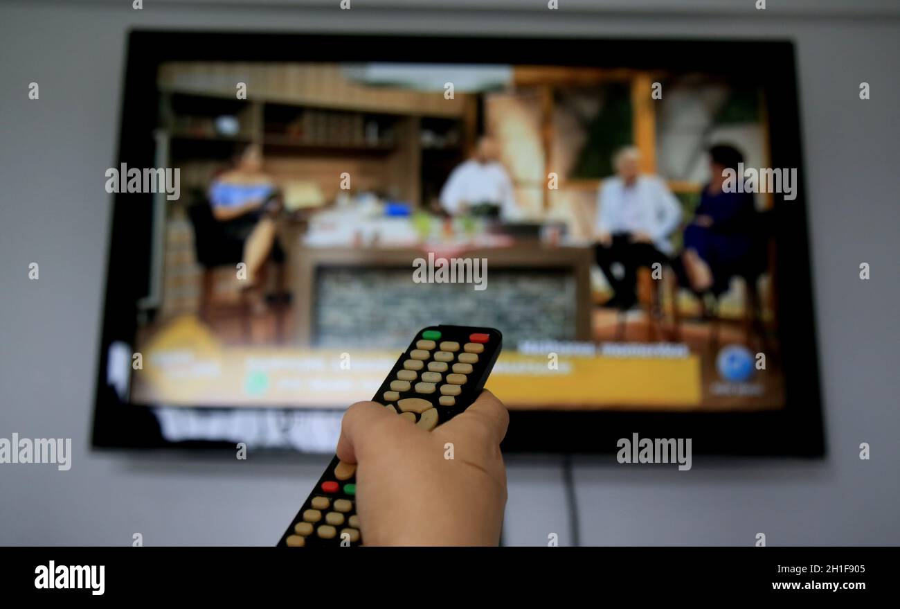 salvador, bahia / brazil - may 21, 2020: hand holds television remote ...