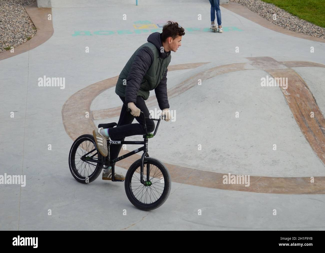 Dobrograd, Vladimir region, Russia. 22 October 2017. Teens on BMX bike and scooter in the ...