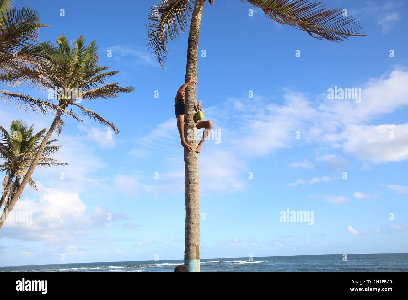 salvador, bahia / brazil - october 10, 2017: Man is seen climbing on ...