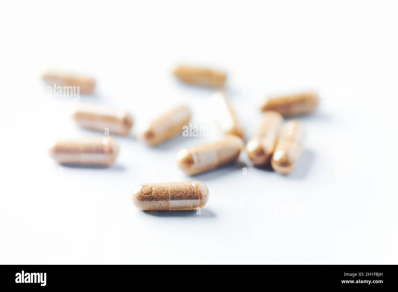 Ashwagandha (Withania somnifera) capsules. Bright paper background ...