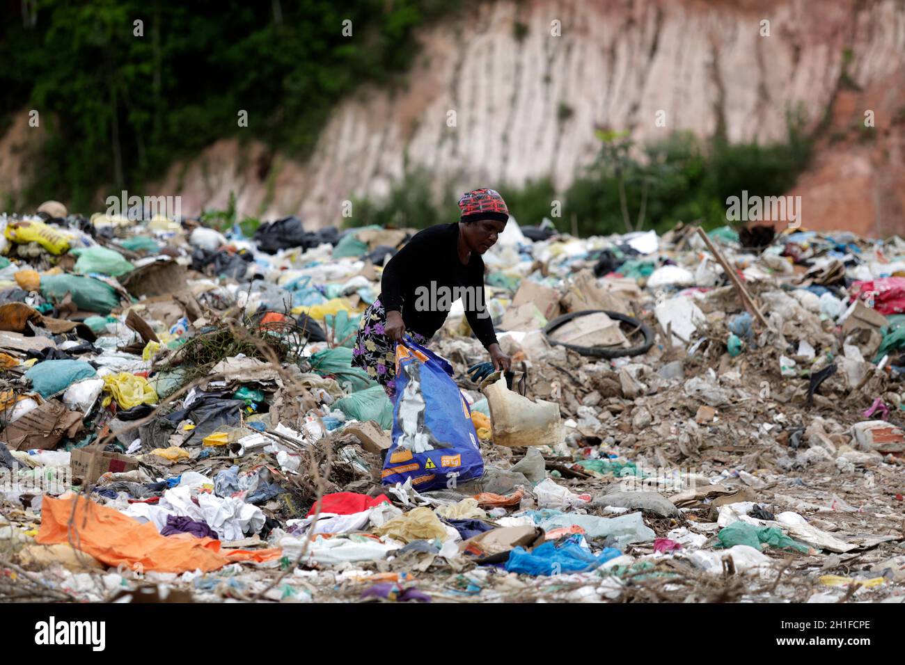 catu, bahia / brazil - may 2, 2019: person is seen collecting material ...