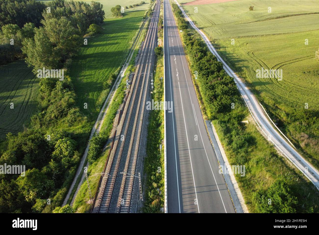 Aerial view, railway and road in rural landscape Stock Photo - Alamy