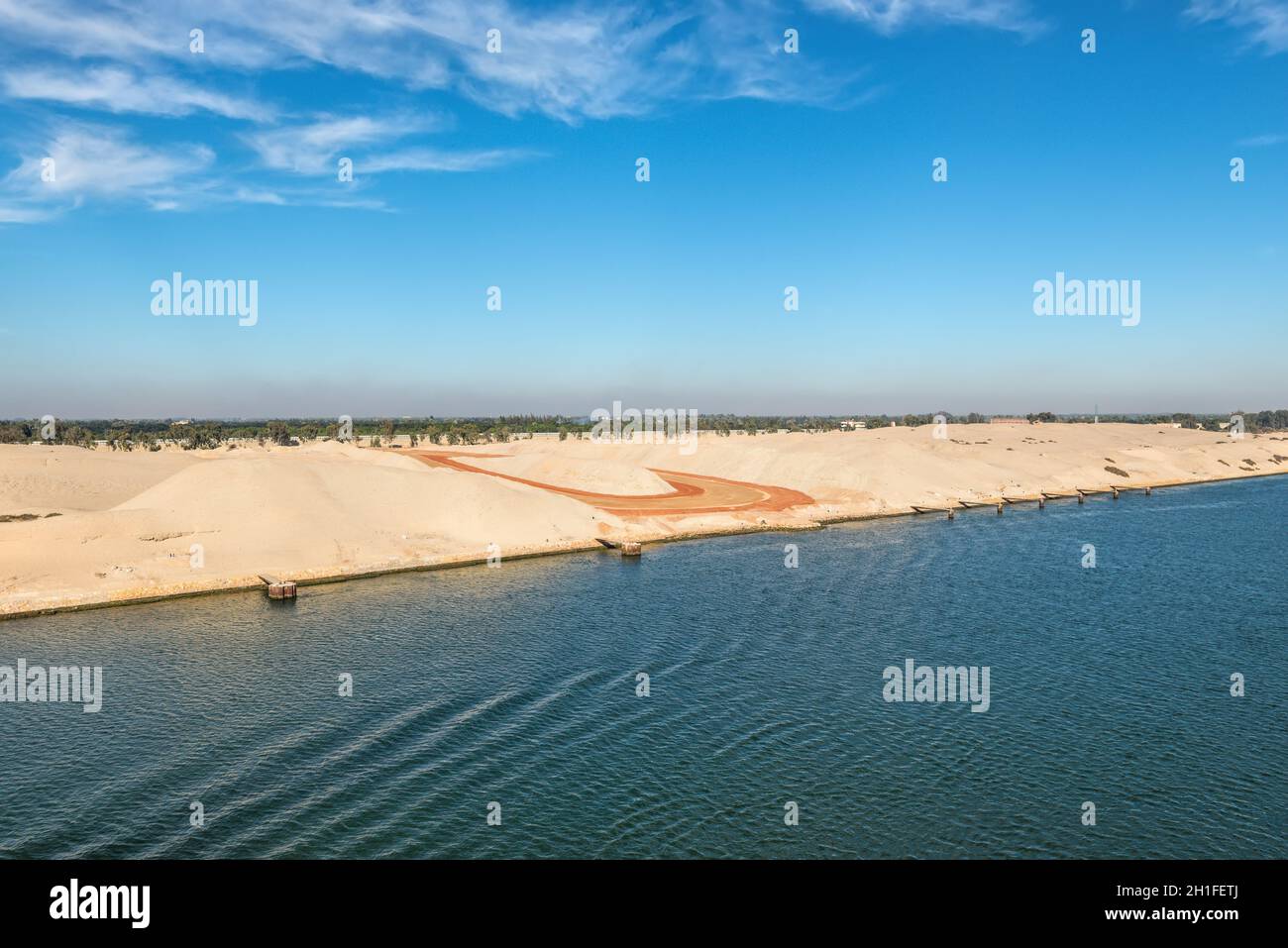 The western side of Suez Canal. Foreground - construction site. In the ...