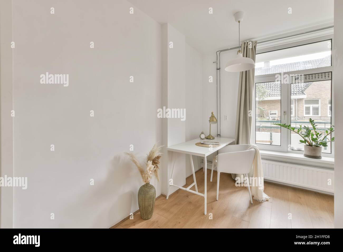 Beautiful living room design with a working desk near a window Stock ...