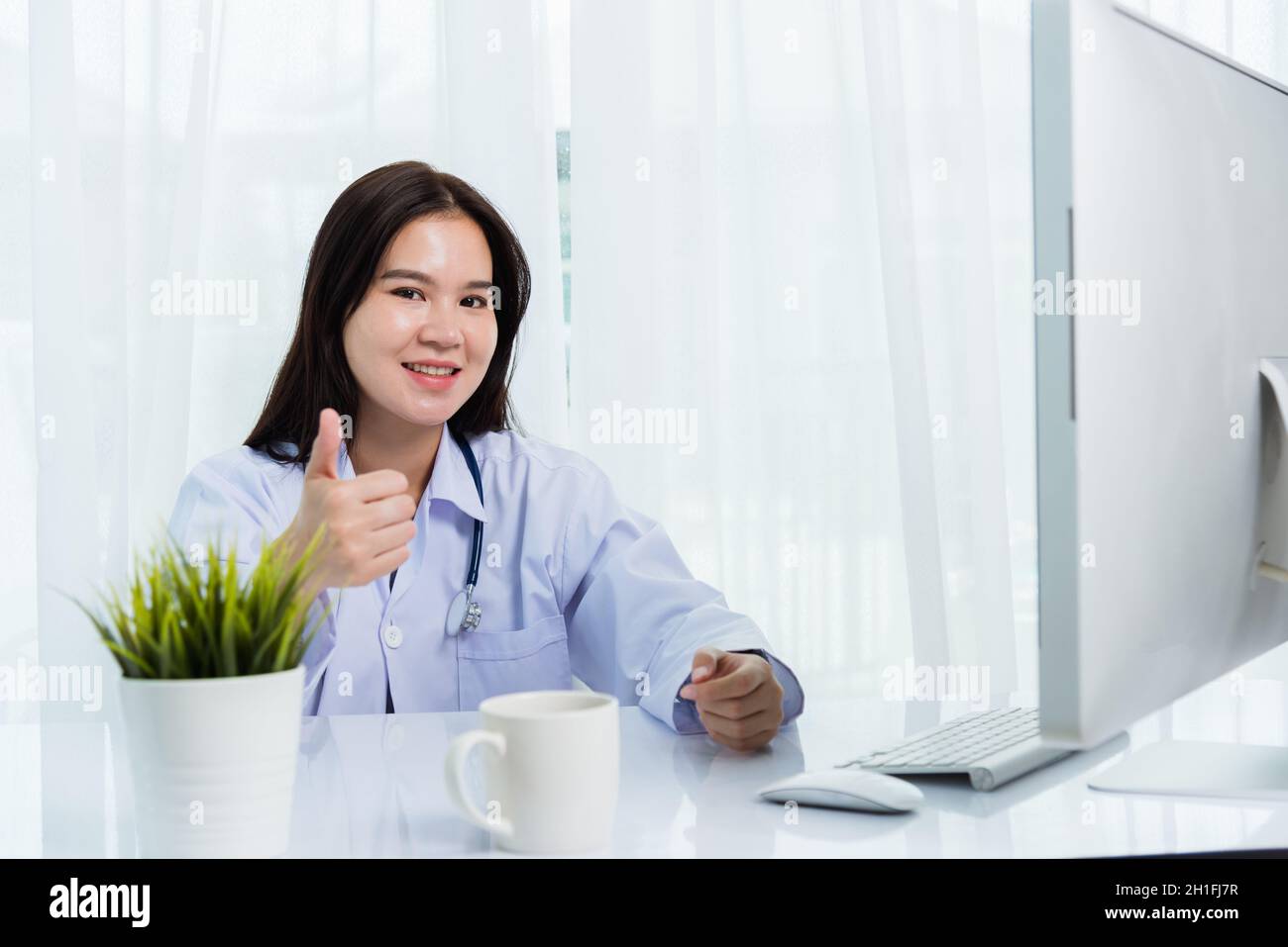 Asian young beautiful woman doctor raise hand finger thumb up for good ...