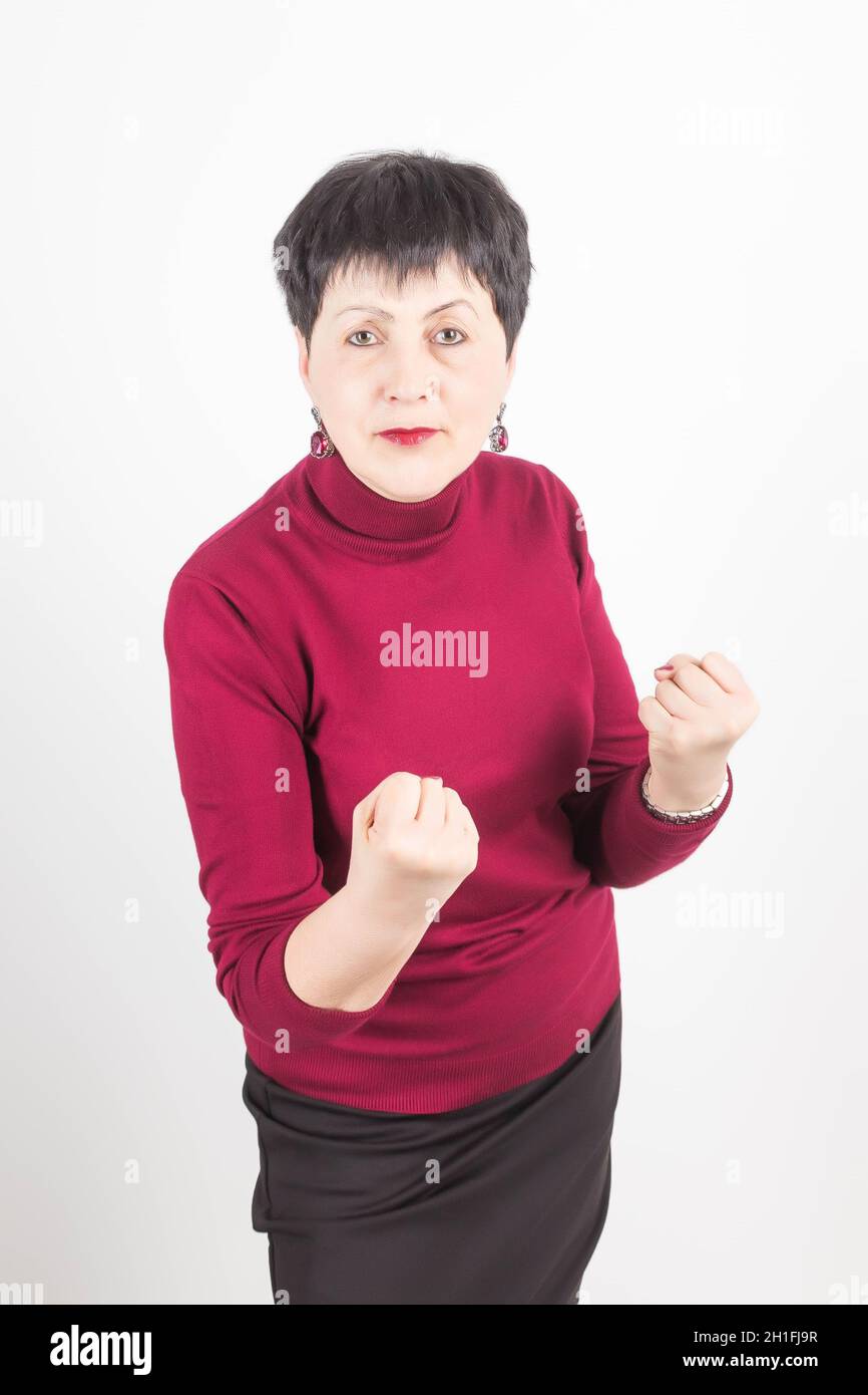 Photo of angry woman frowns face, shows fist, has dissatisfied facial ...