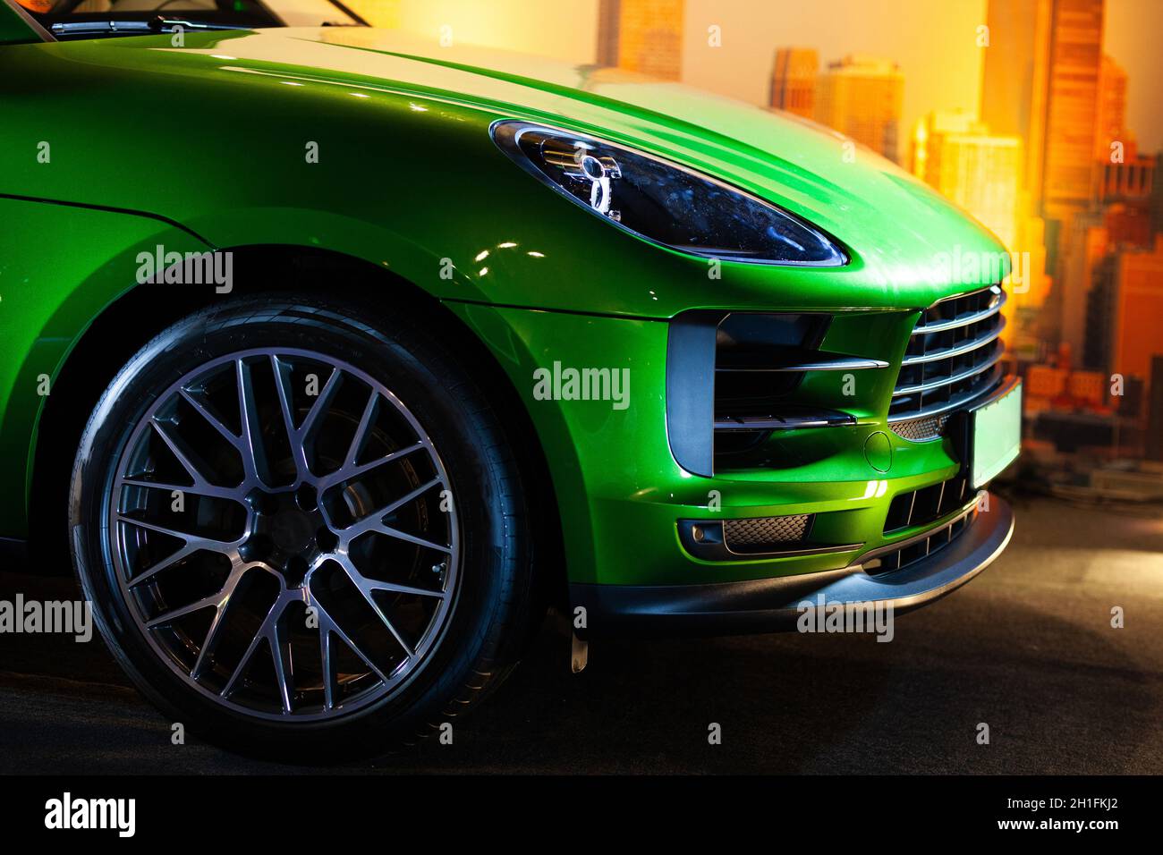 Green car on the street of a big city, on the landing Stock Photo - Alamy