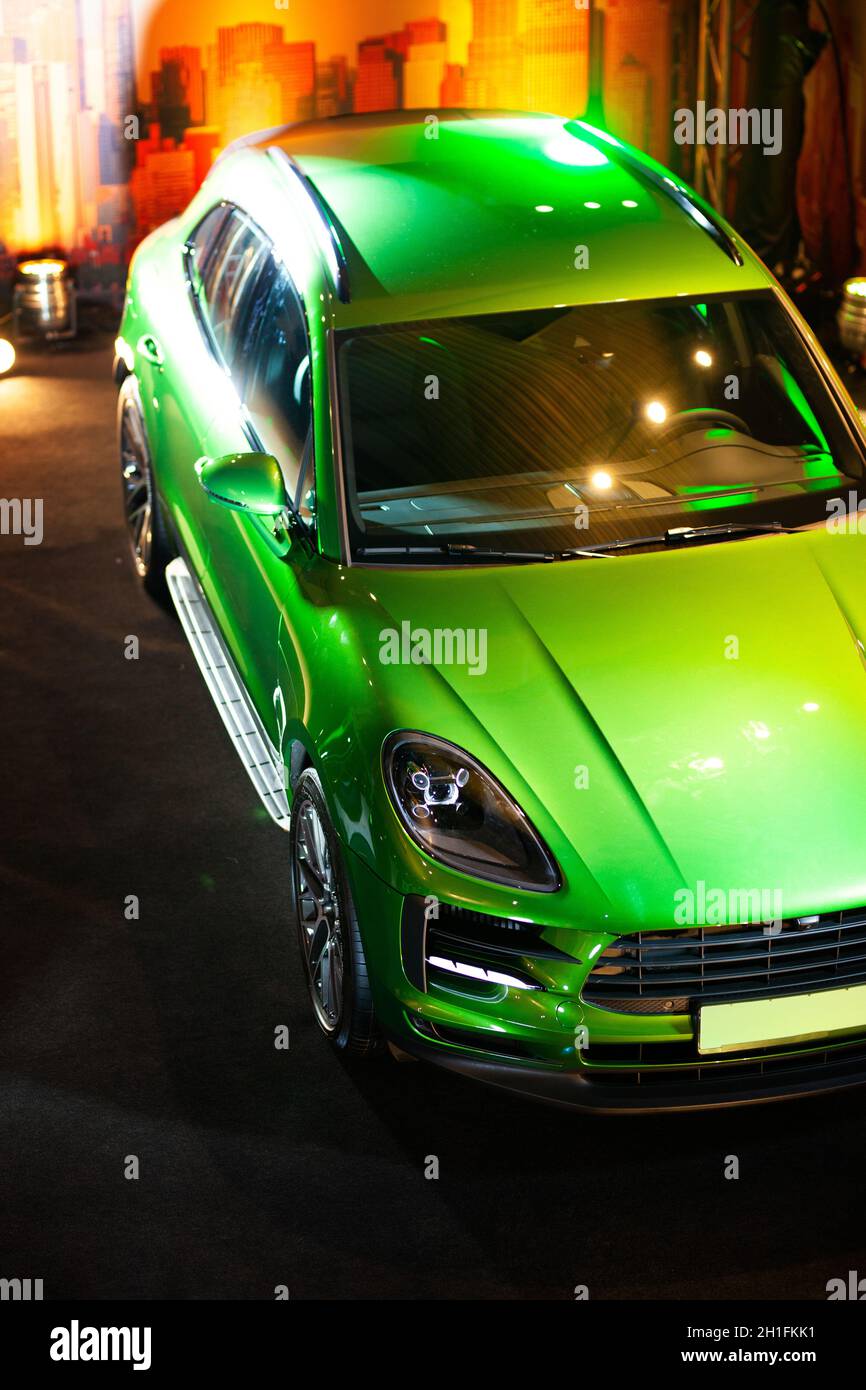 Green car on the street of a big city, on the landing Stock Photo - Alamy