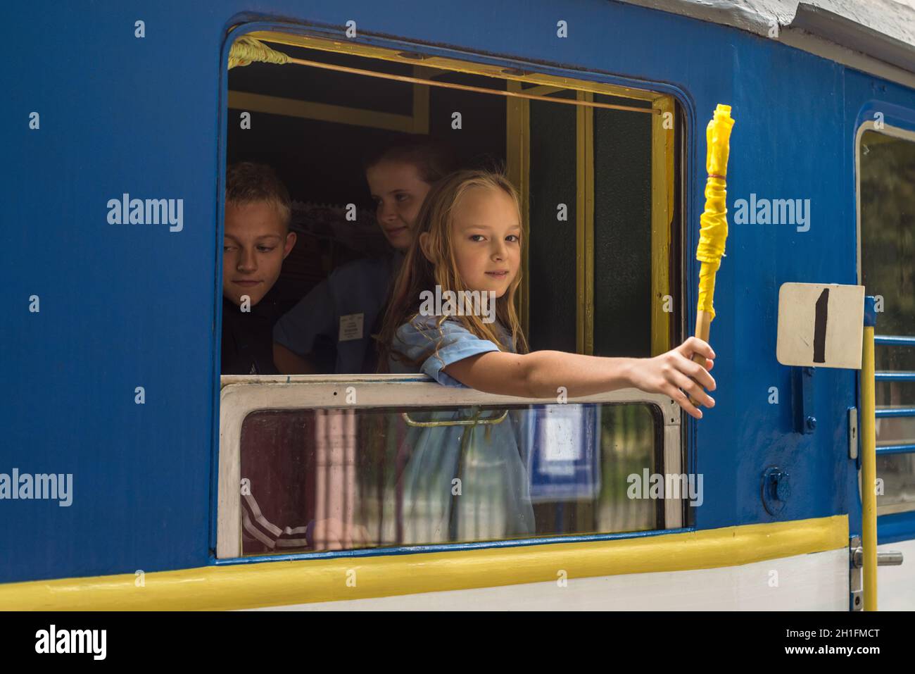 Kyiv, Ukraine - August 3, 2013: The Conductor girl gives a signal to ...