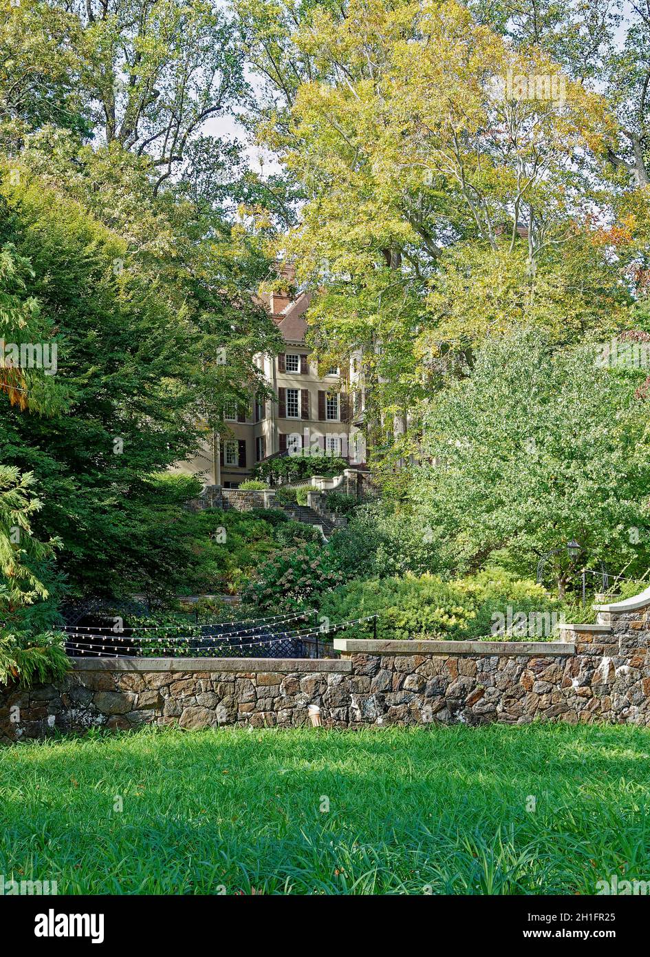 Winterthur Museum & Garden, glimpse of mansion through trees, lights ...