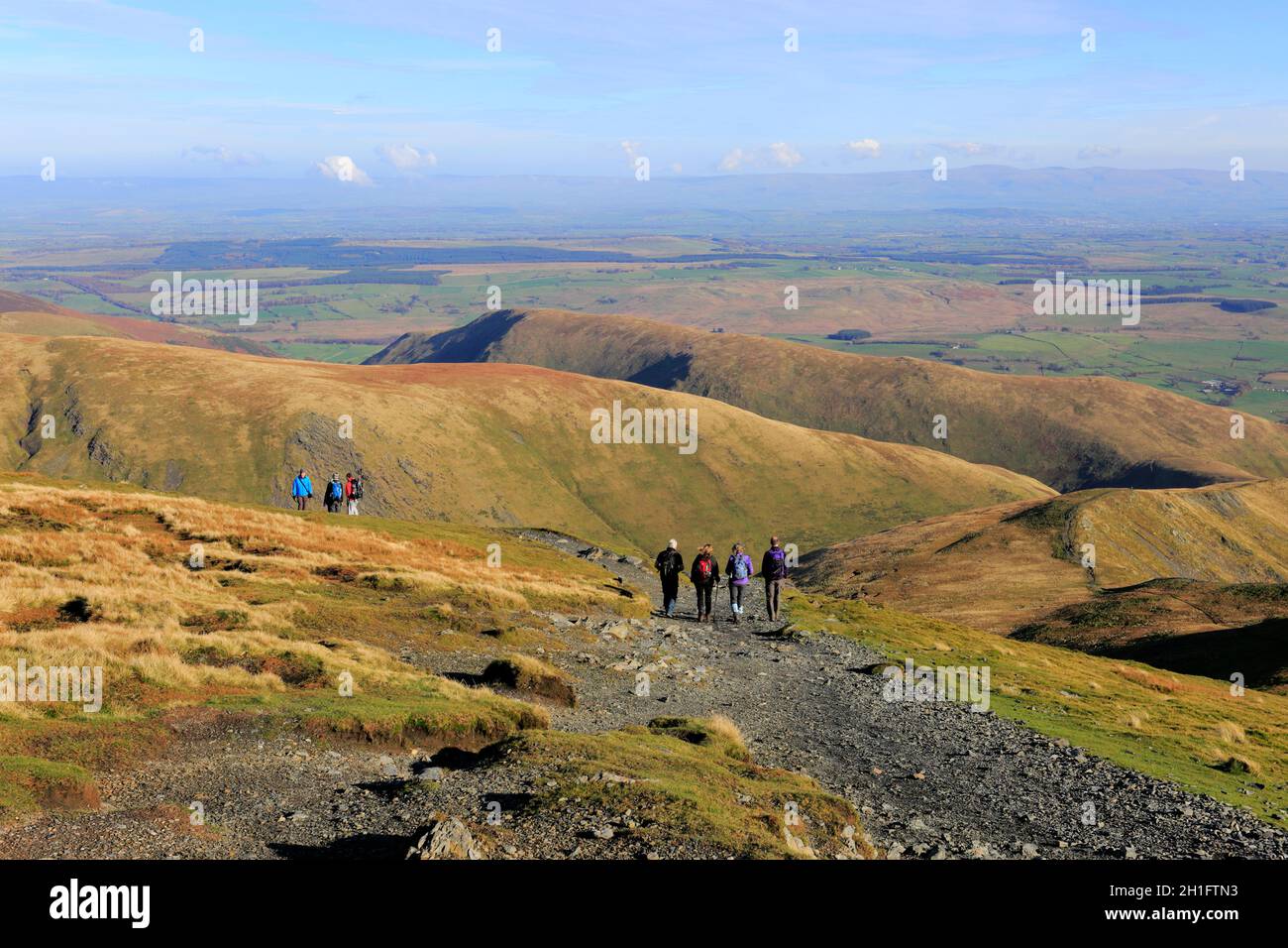 Walkers on the summit ridge of Blencathra fell, Lake District National ...