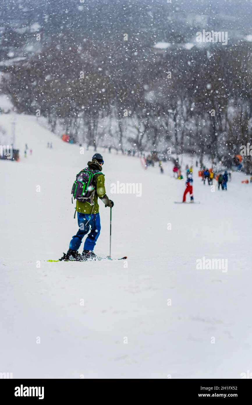 People riding down ski slope hi-res stock photography and images - Alamy