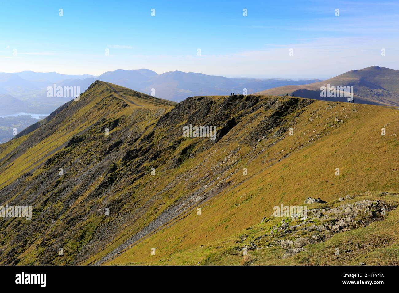 Walkers on the summit ridge of Blencathra fell, Lake District National ...