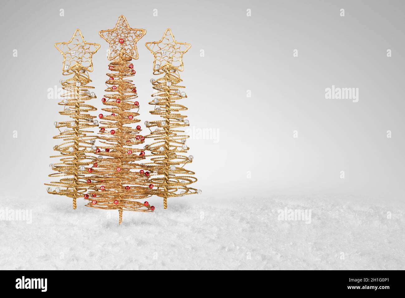 Gold wire tree Christmas Decoration on a fake snow background Stock ...