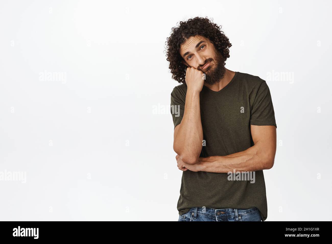 Skeptical and unamused middle-eastern man, looking with dislike and ...