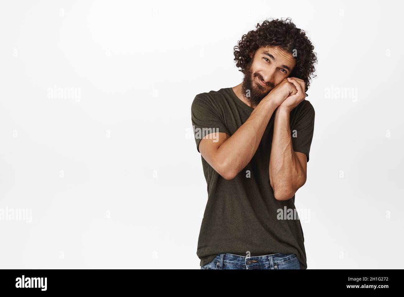 Image of middle-eastern young man looking cute, making silly tender ...