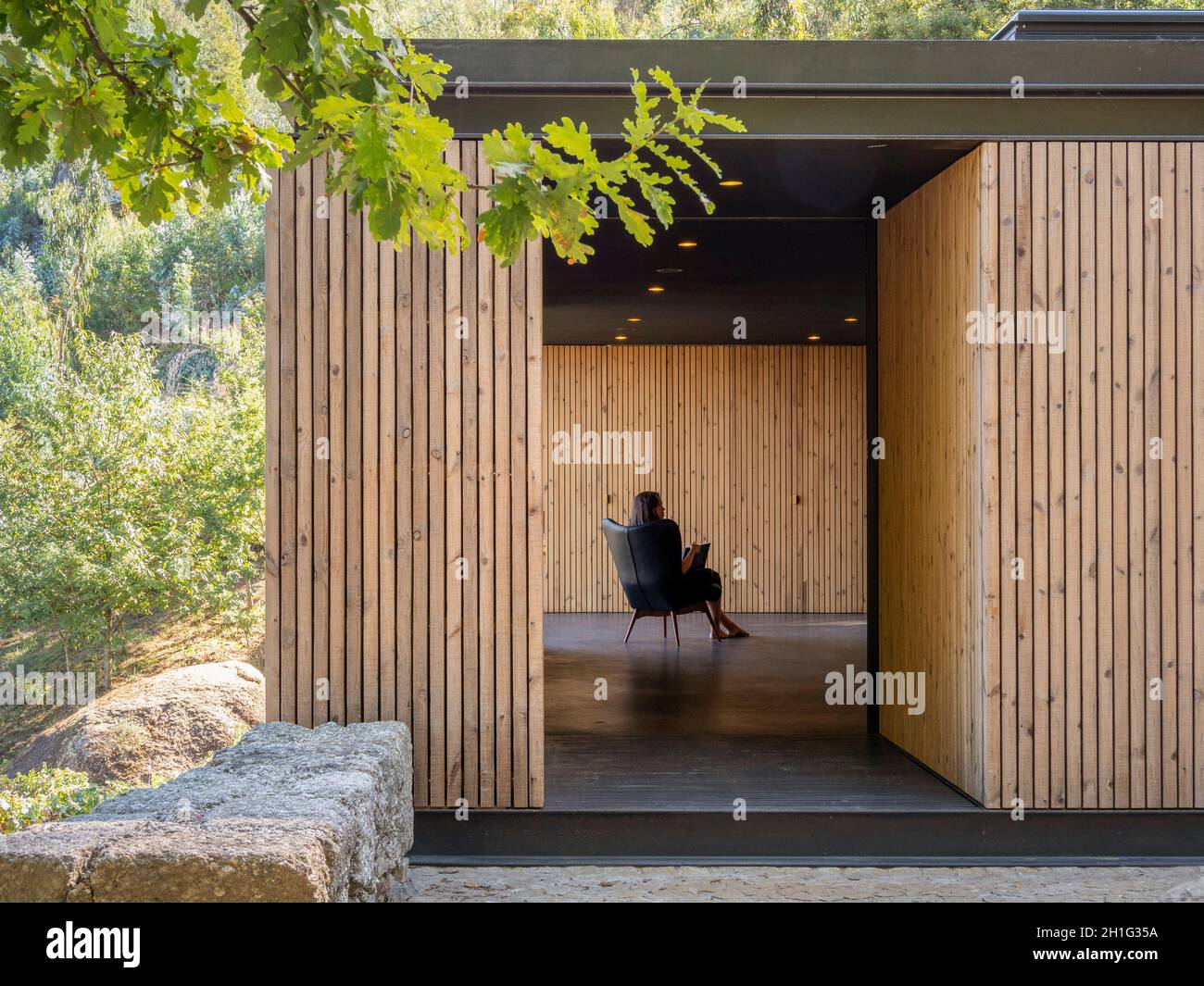 Open entrance door with view through. Pavilion House, Guimarães ...