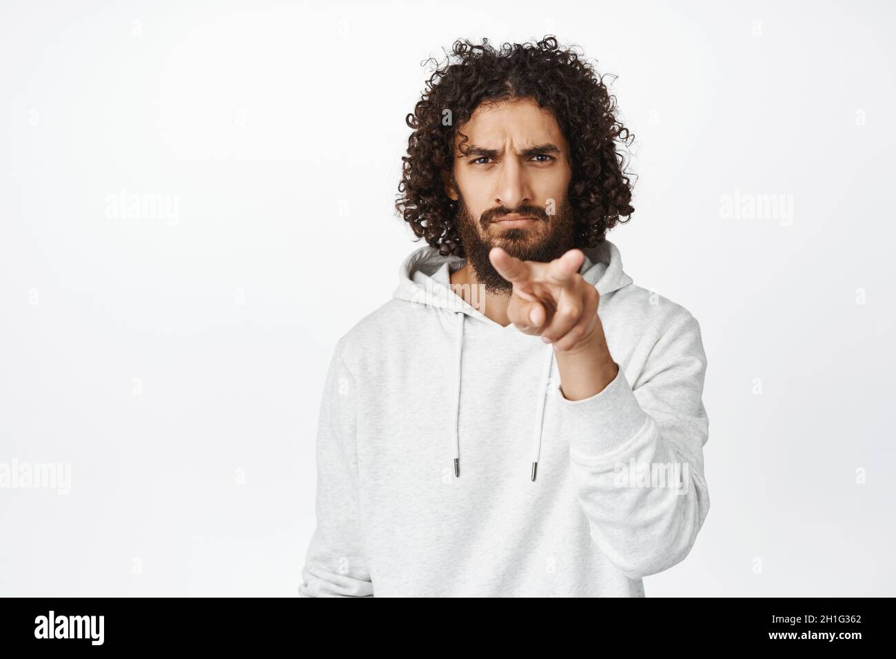 I am watching you. Serious guy I see gesture, eye contact sign, looking ...