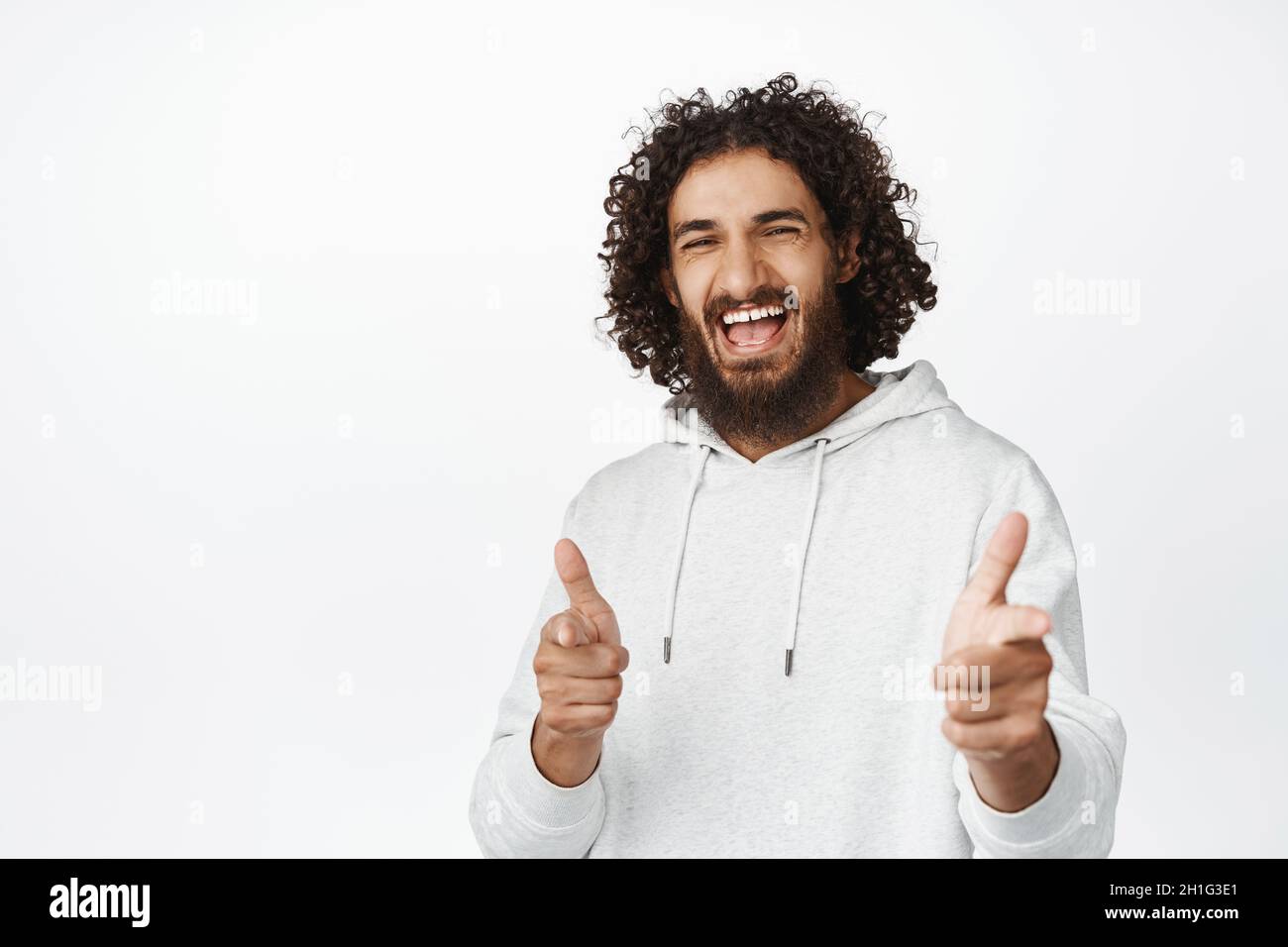 Congrats. Happy smiling young man pointing at camera, you winner ...