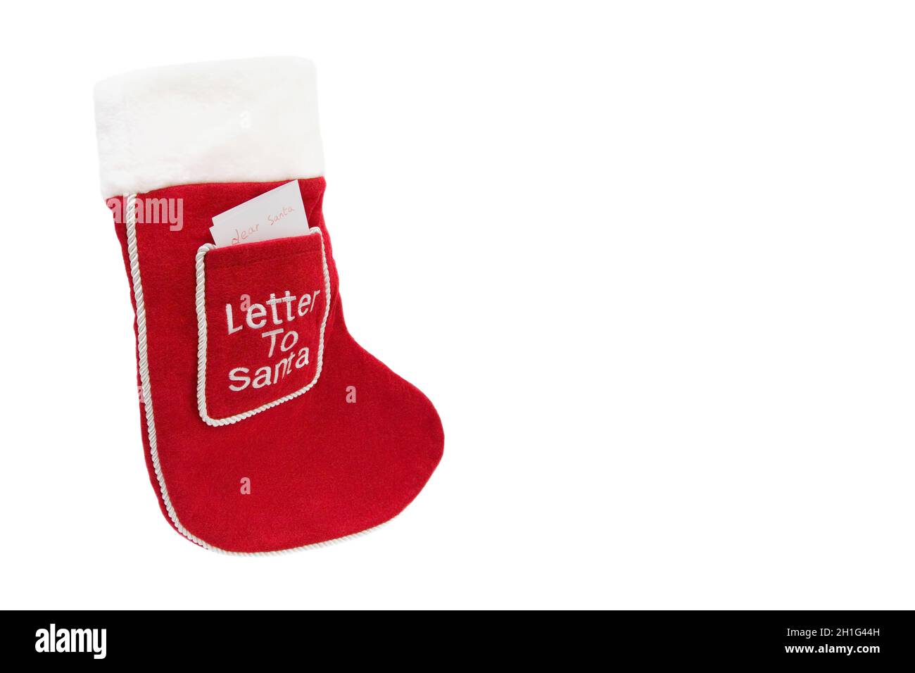 Red Christmas stocking with a letter to Santa in the front pocket Stock ...