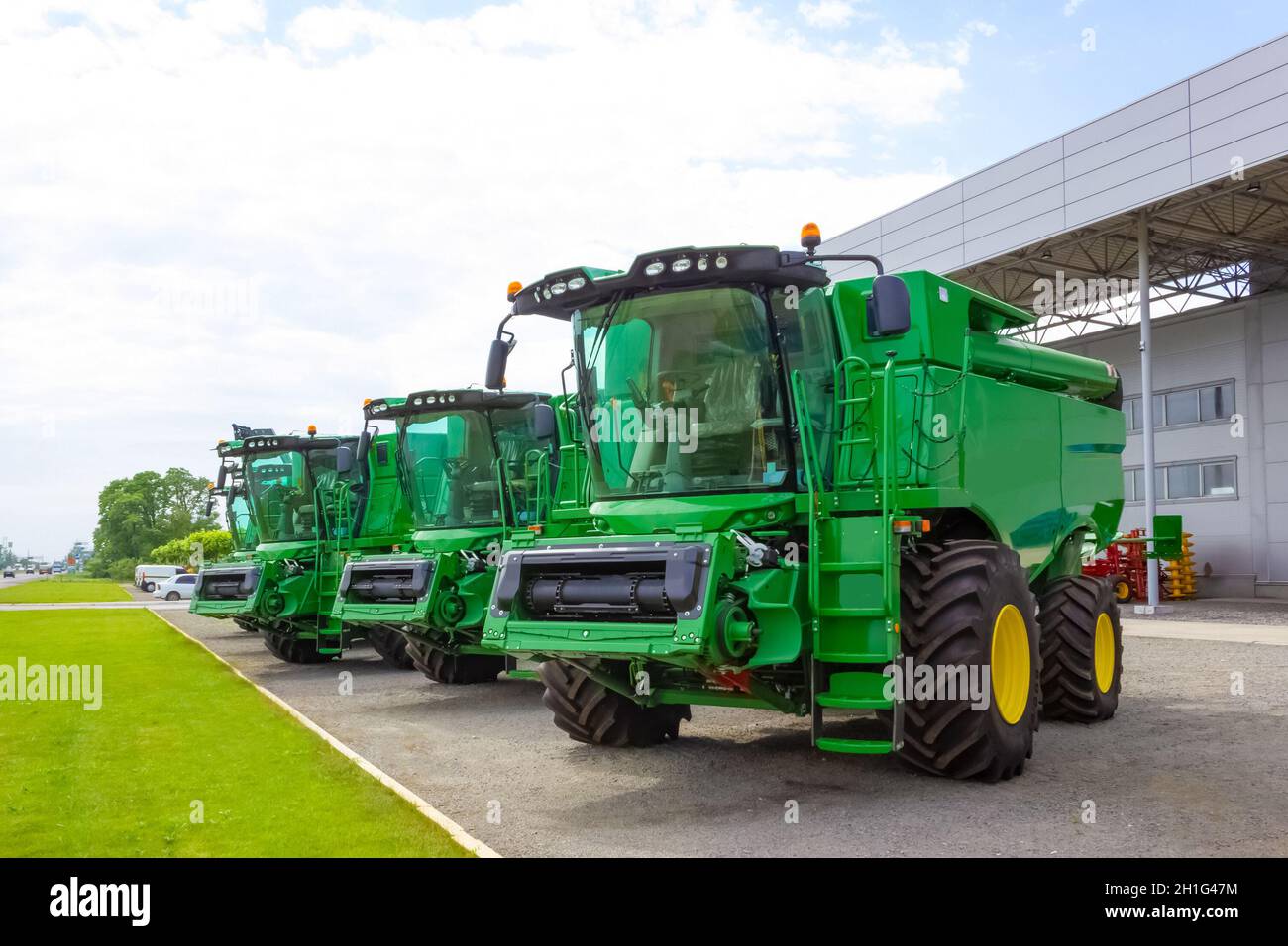 Modern combines at road. The agriculture, farming concept Stock Photo ...
