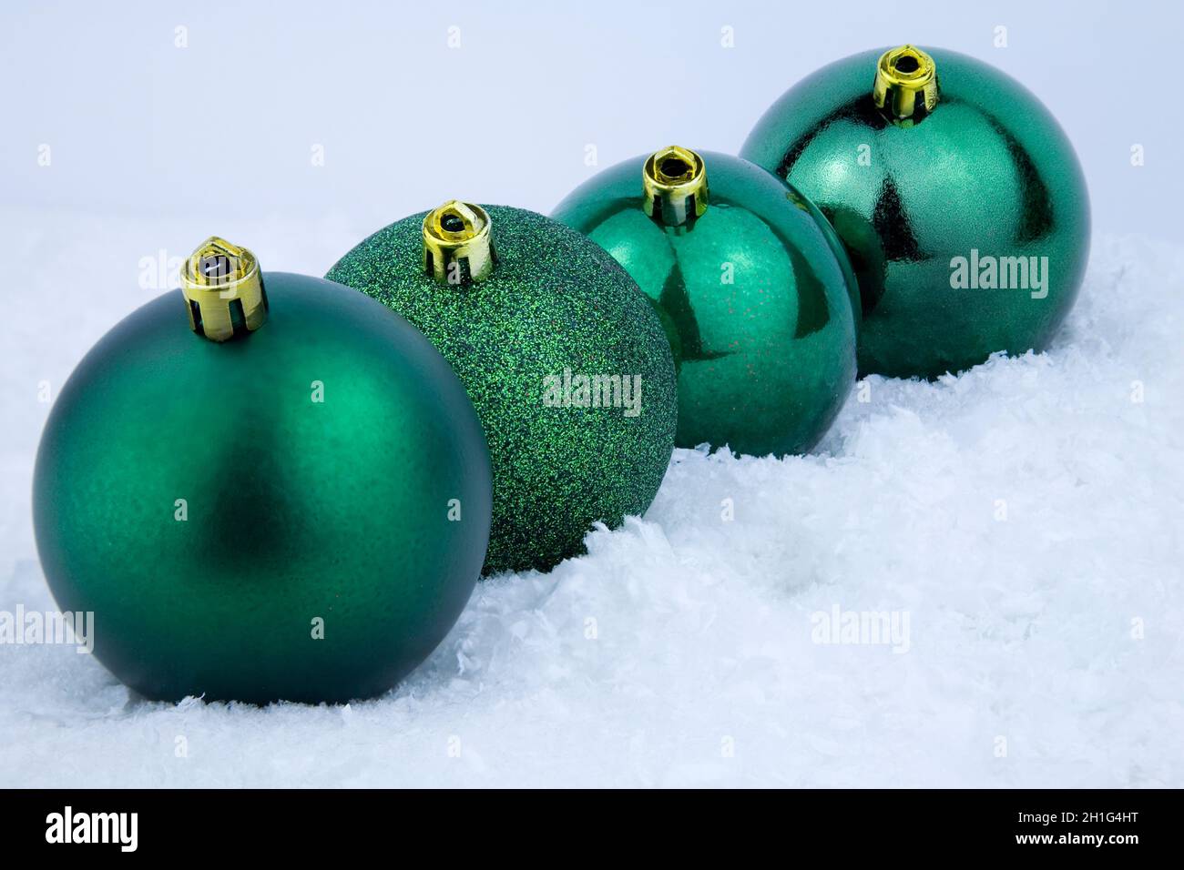Grey and Silver Christmas Bauble on fake white snow Stock Photo - Alamy
