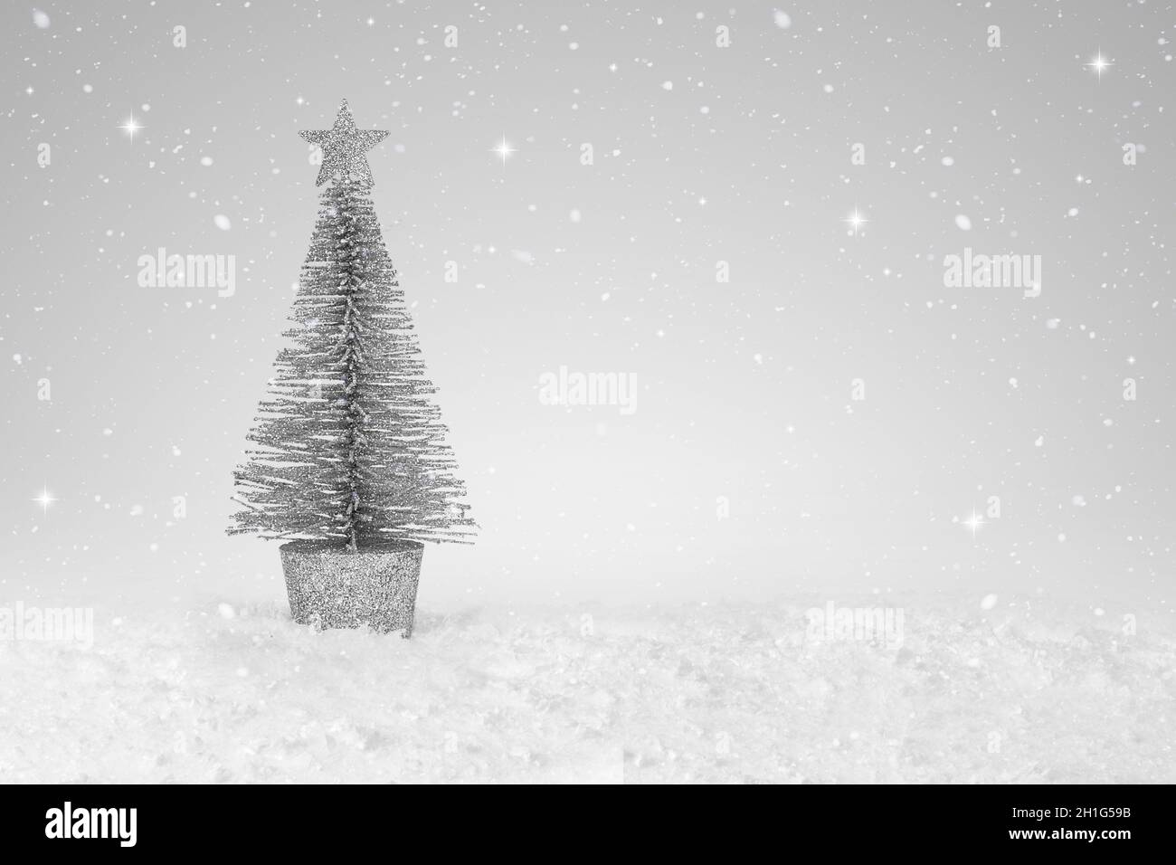 Silver tree shape Christmas Decoration on a fake snow background Stock ...